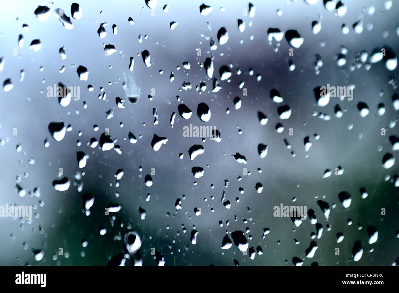 Raindrops on a window pane Stock Photo - Alamy