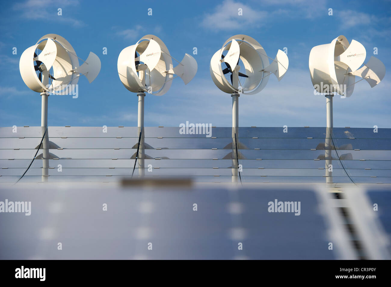 Small wind turbines and solar panels on a hotel roof, Freiburg im ...