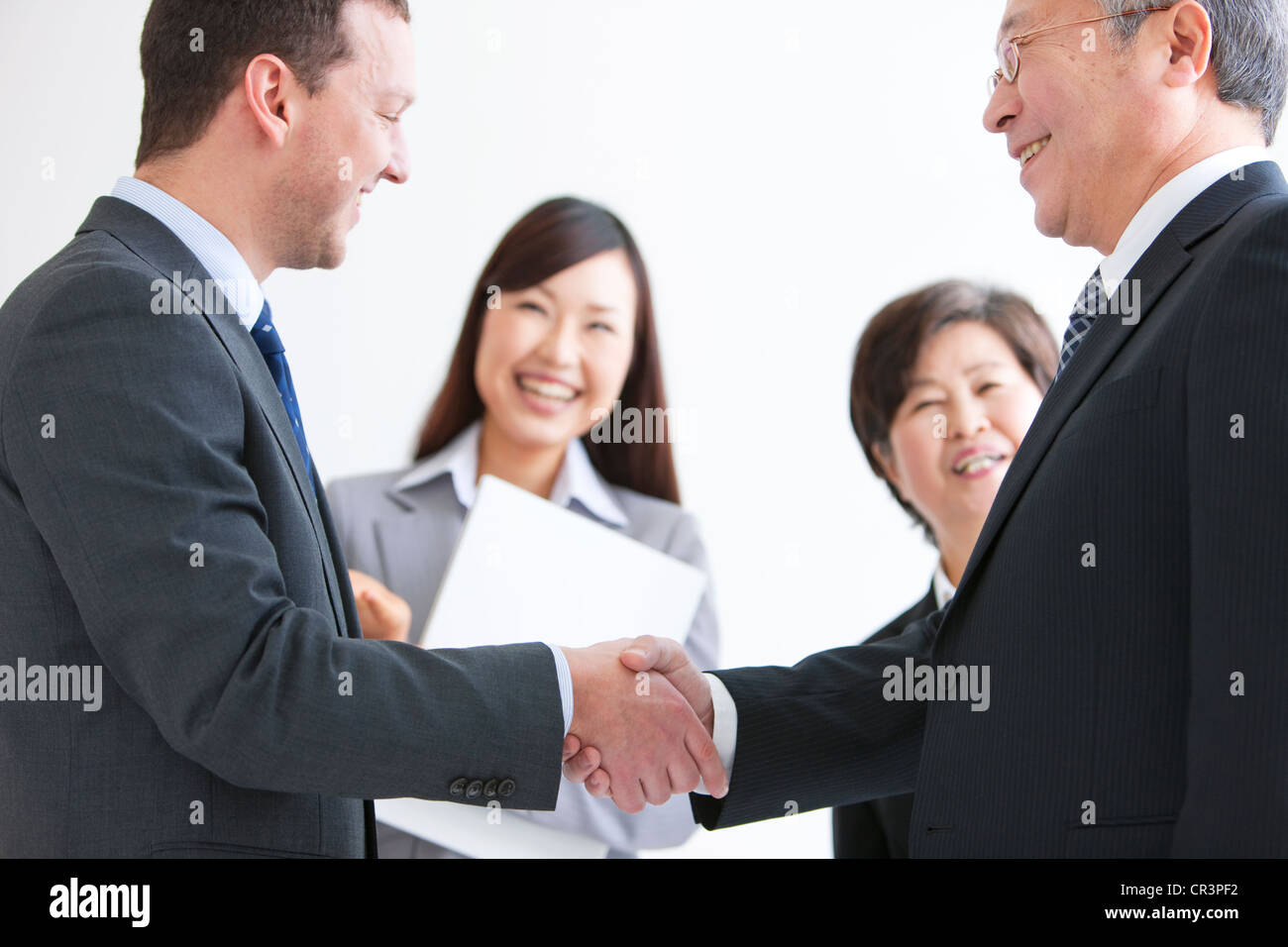 Businessmen and Women In a Meeting Stock Photo - Alamy