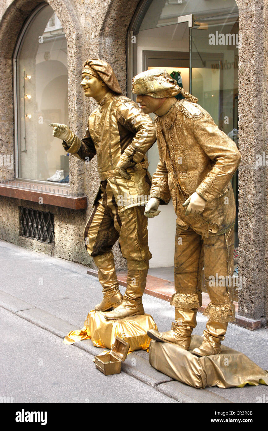 Two gold painted mime artists perform in the 'Old Town', Salzburg ...