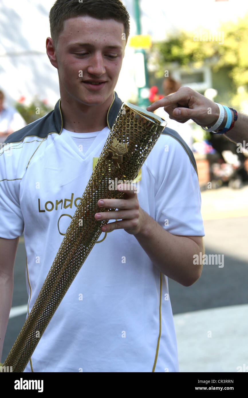 Olympic torch runner on Stow Hill in the city of Newport South Wales GB ...