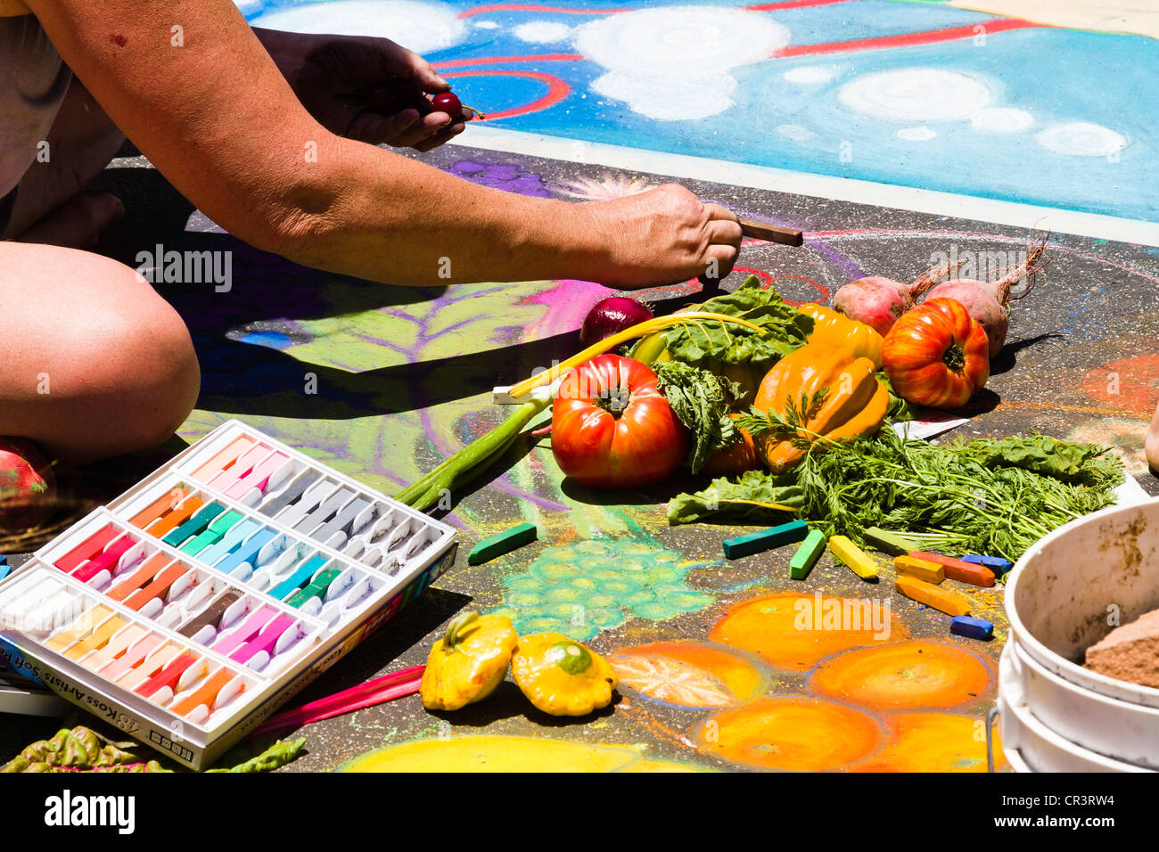 Artist drawing with chalk on pavement Stock Photo - Alamy