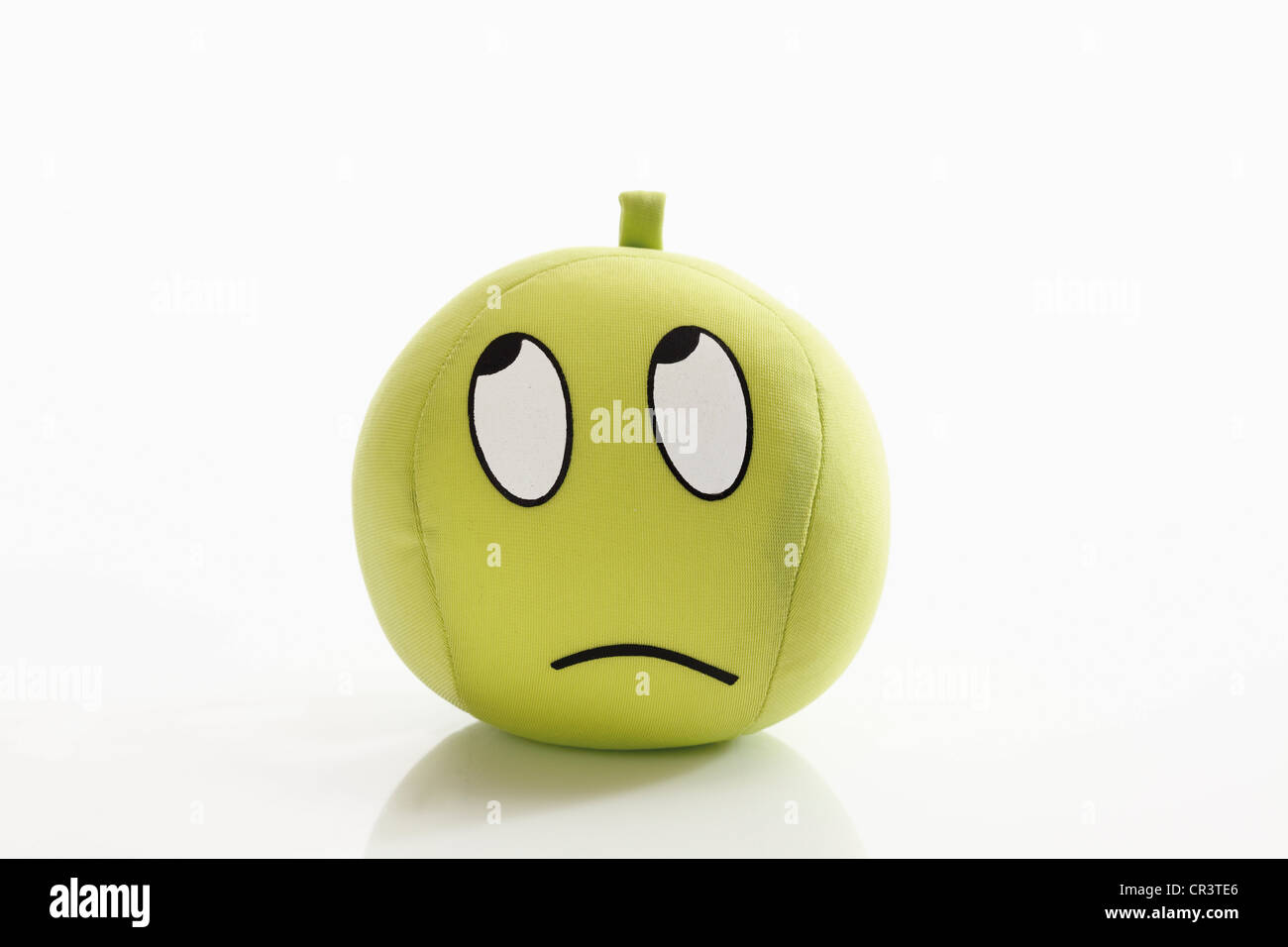Green ball with a sceptical face Stock Photo - Alamy