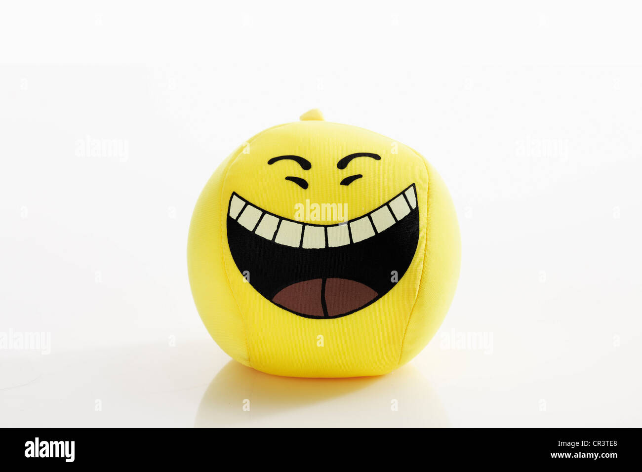 Yellow ball with a laughing face Stock Photo - Alamy