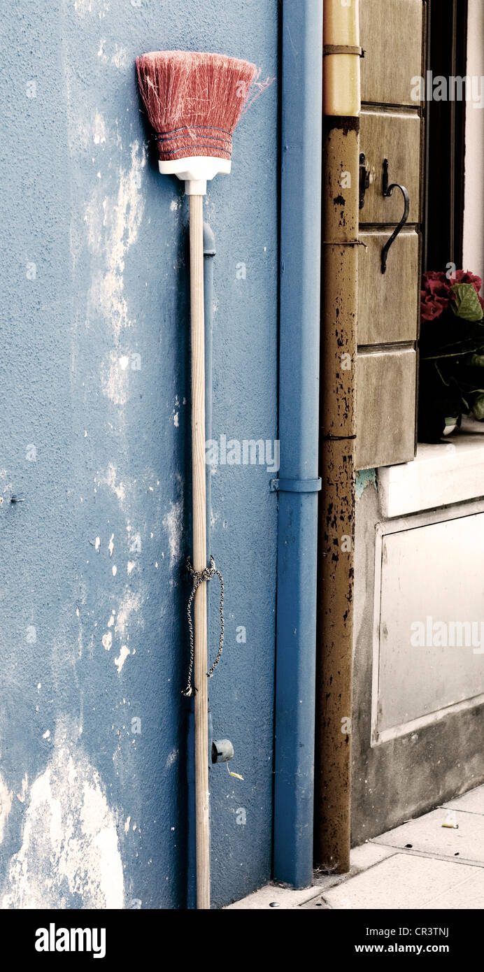 Broom on a house wall, Burano, Italy, Europe Stock Photo - Alamy