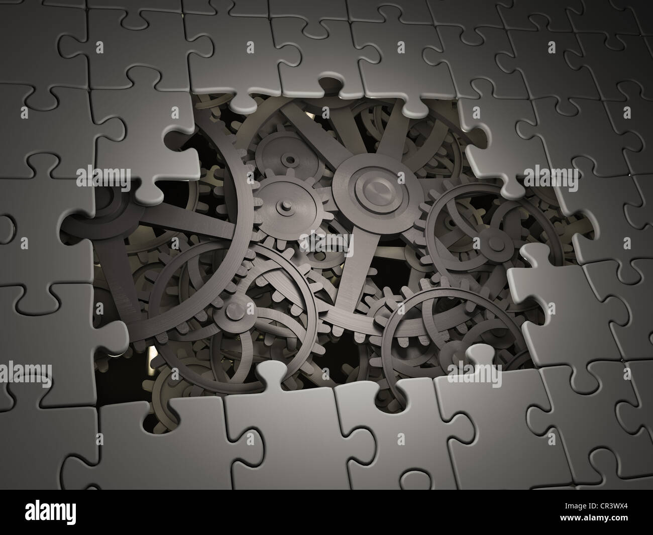 Cog wheels coming out from underneath a jigsaw puzzle Stock Photo - Alamy