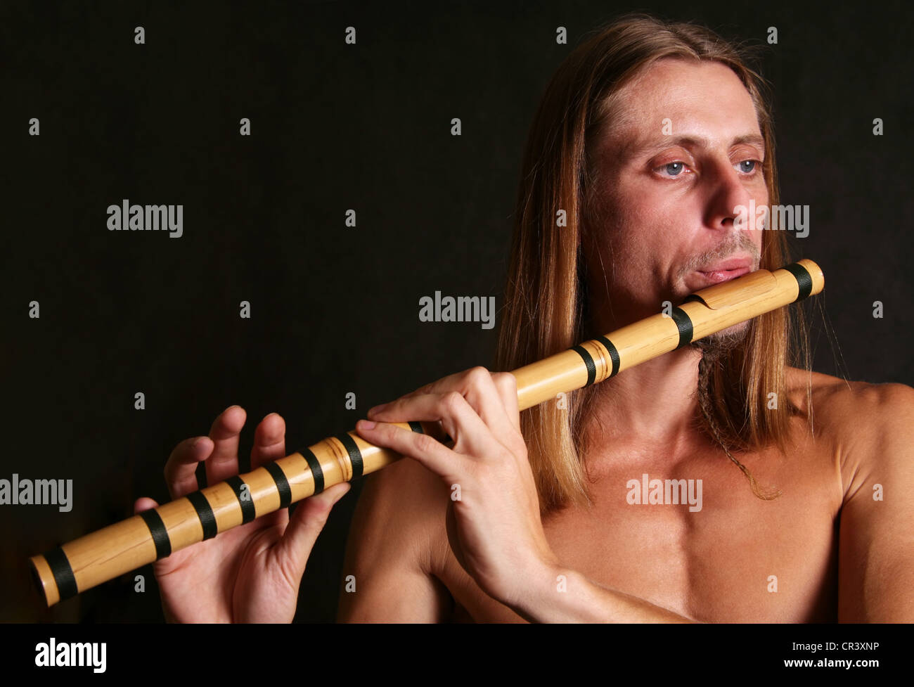 A man playing his wind instrument with expression Stock Photo - Alamy