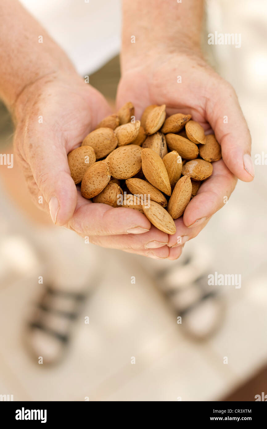 Man handfull of nuts hi-res stock photography and images - Alamy