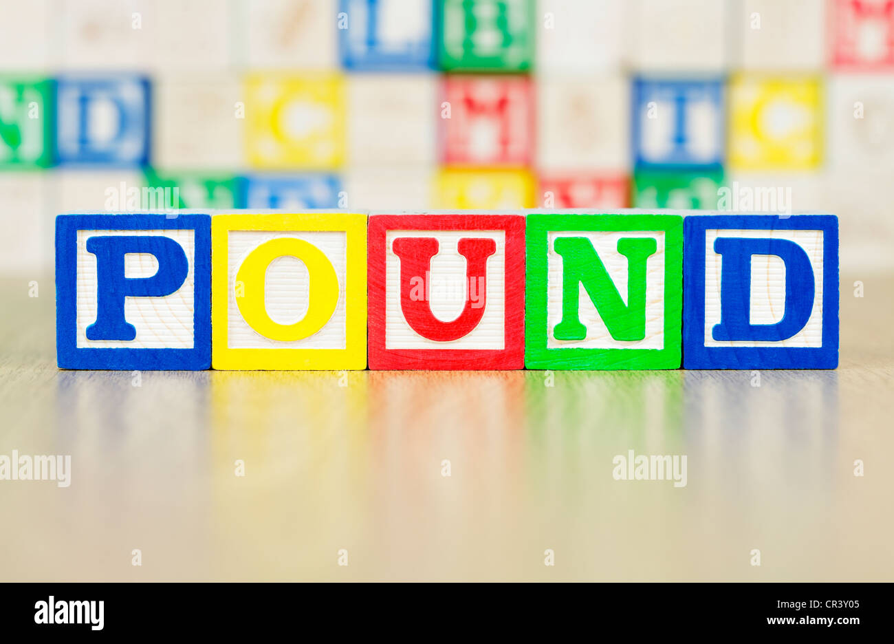 POUND Spelled Out in Alphabet Building Blocks Stock Photo - Alamy