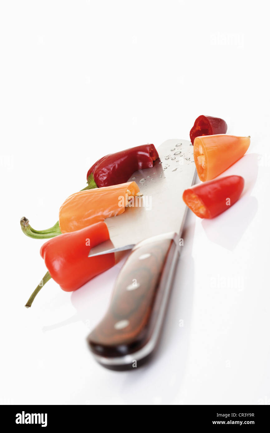 Peperoni (Capsicum) on a knife's edge Stock Photo - Alamy