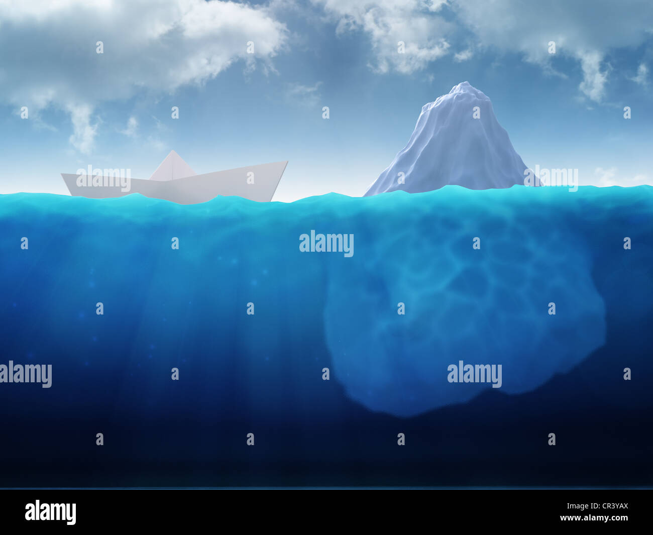 A small paper ship heading into an iceberg Stock Photo - Alamy