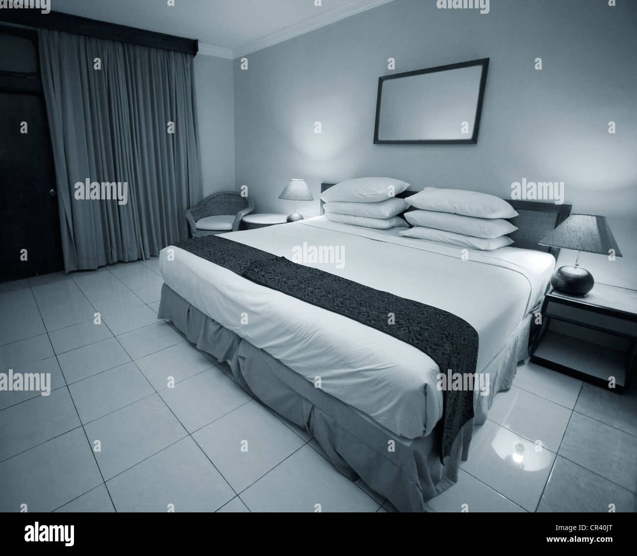 Nice bedroom with the big bed Stock Photo - Alamy