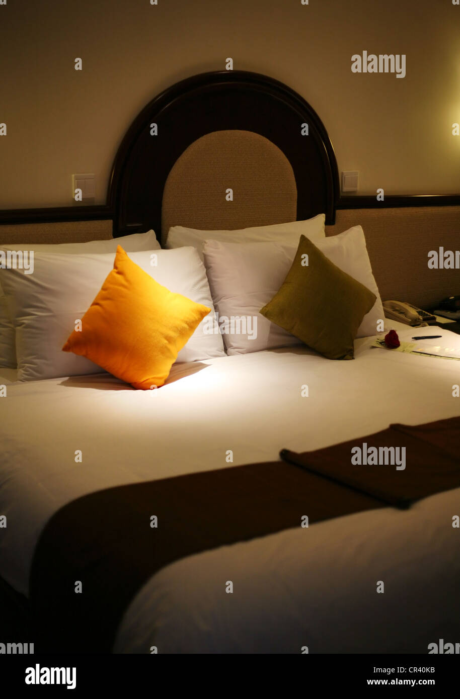 Nice bedroom with the big bed Stock Photo - Alamy