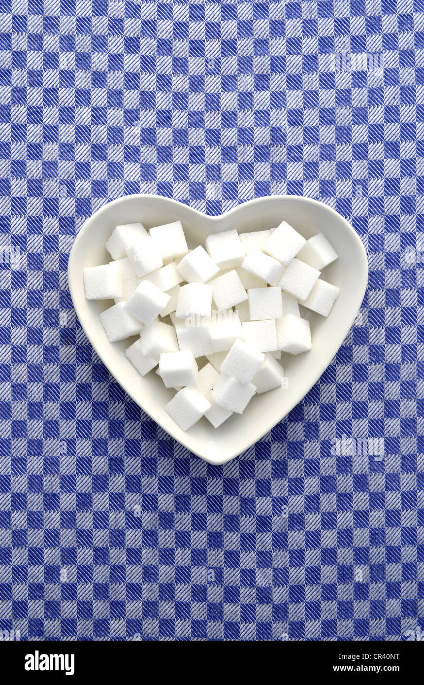 Sugar cubes in a heart-shaped porcelain bowl Stock Photo - Alamy