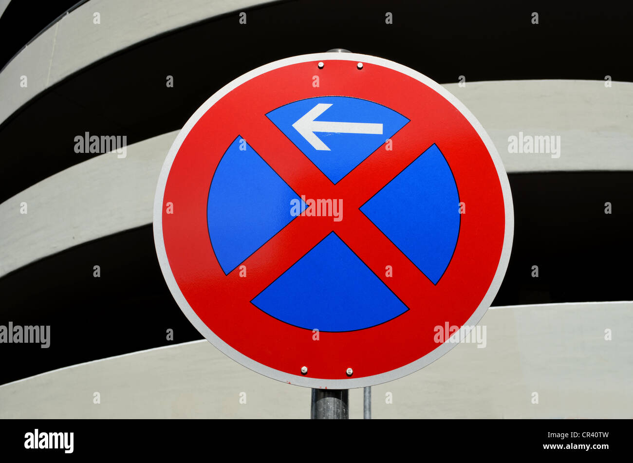 Start of a no stopping area, traffic sign in front of parking garage in ...