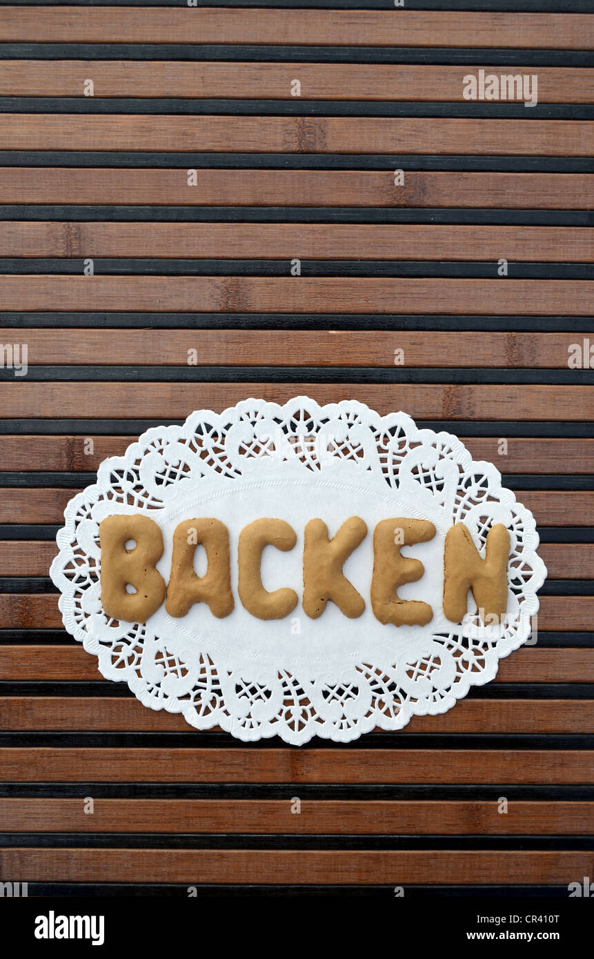 Backen, German for baking, written with alphabet biscuits on a paper ...