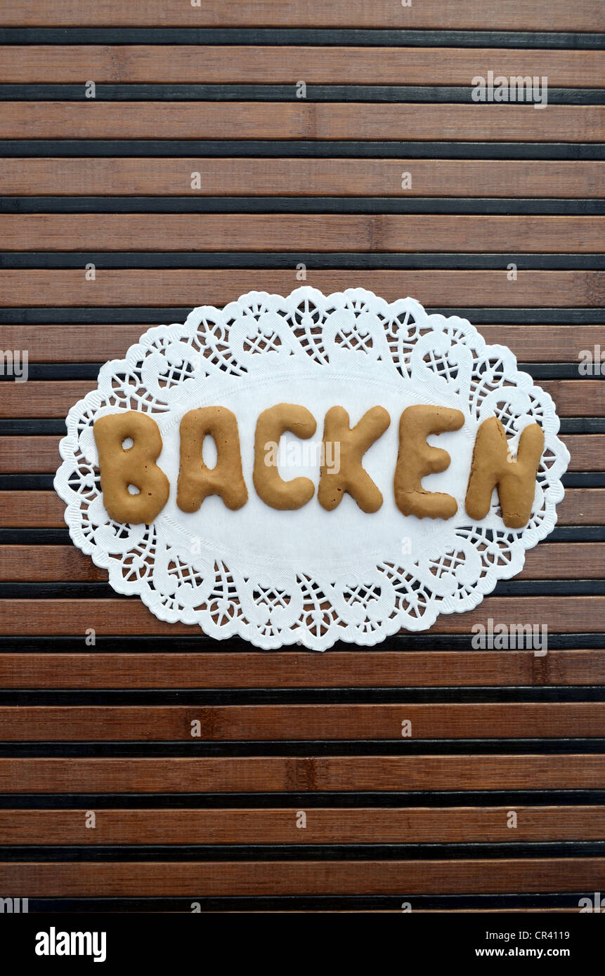 Backen, German for baking, written with alphabet biscuits on a paper ...