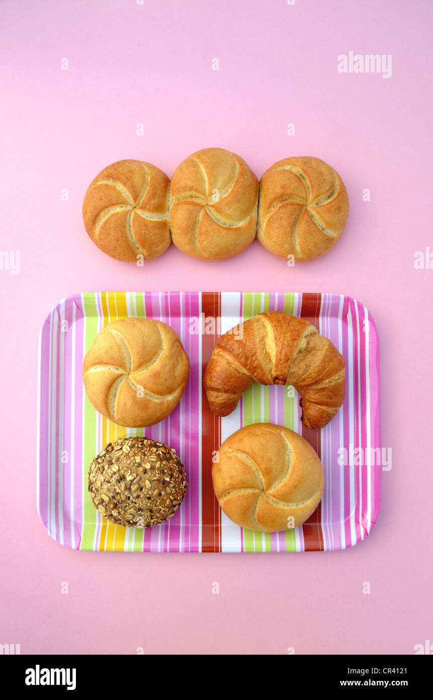 Bread rolls beside a croissant, a bread roll, a wholemeal roll and a ...