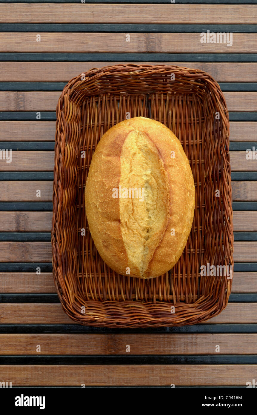 A single bread roll in a basket Stock Photo - Alamy