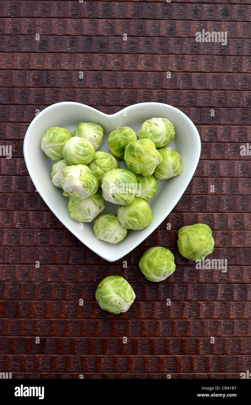 Brussels sprouts in a heart-shaped porcelain bowl Stock Photo - Alamy