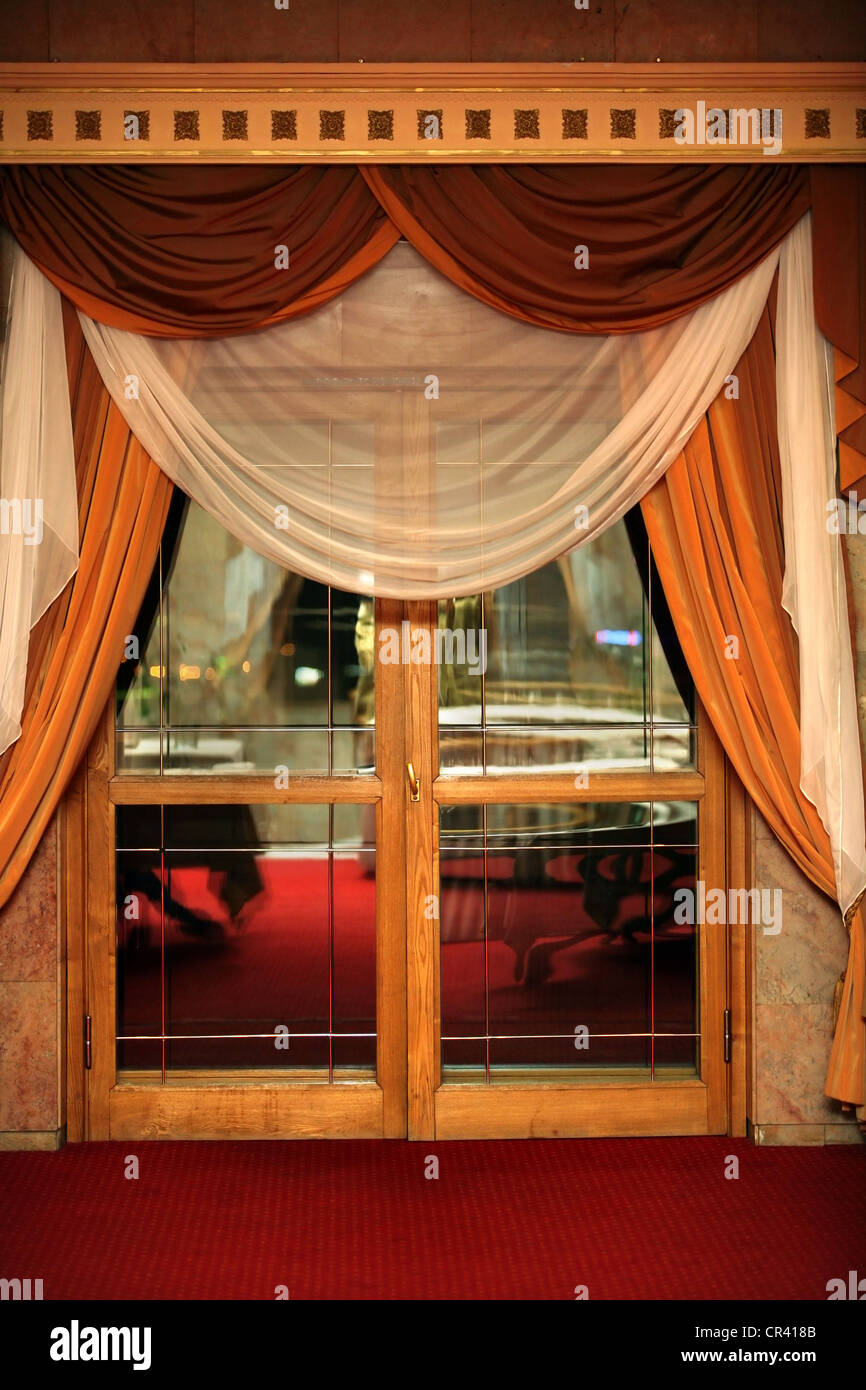 Glass door with portieres Stock Photo - Alamy