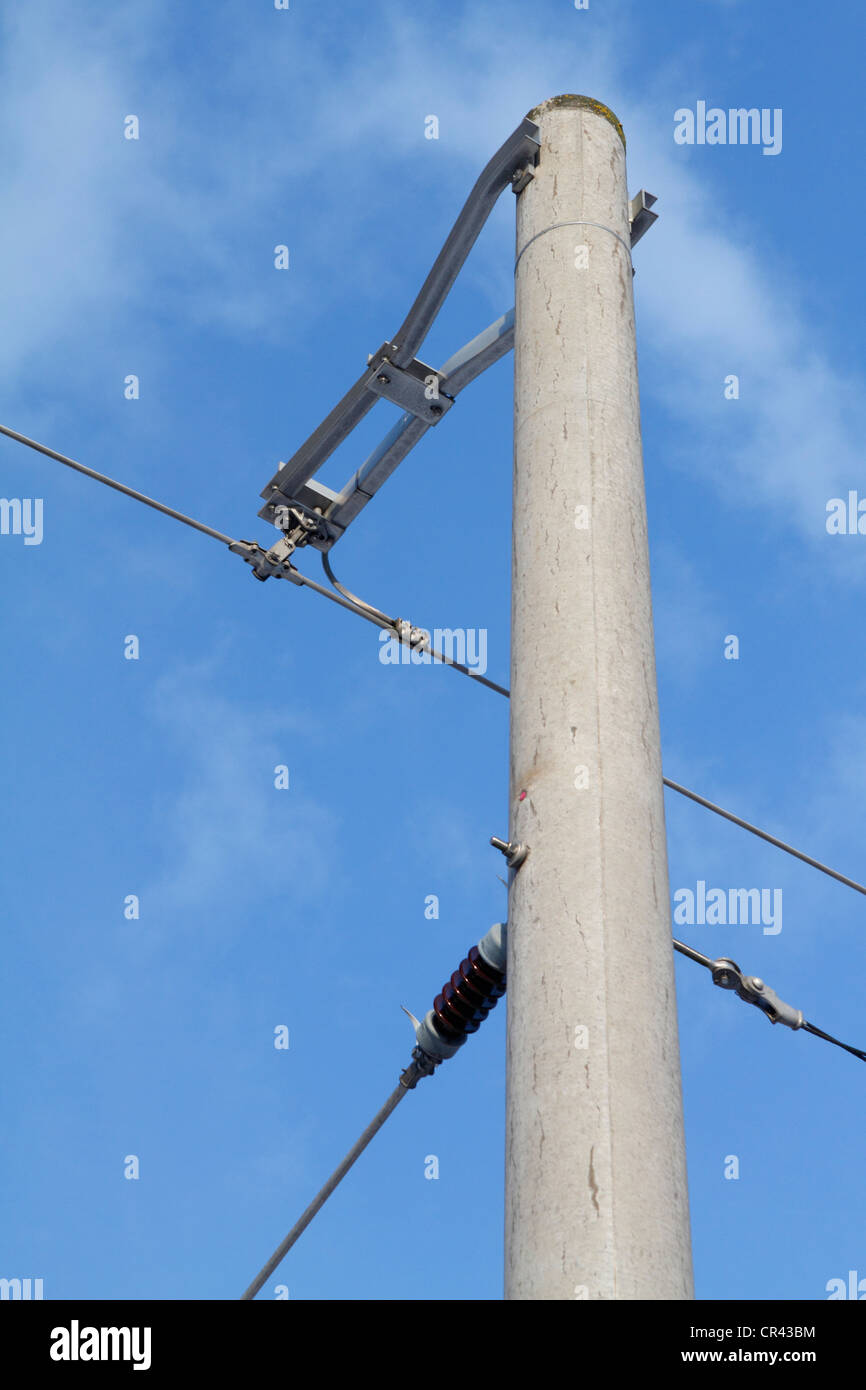 Overhead contact wire at a railway line with blue sky, Hesse, Germany ...