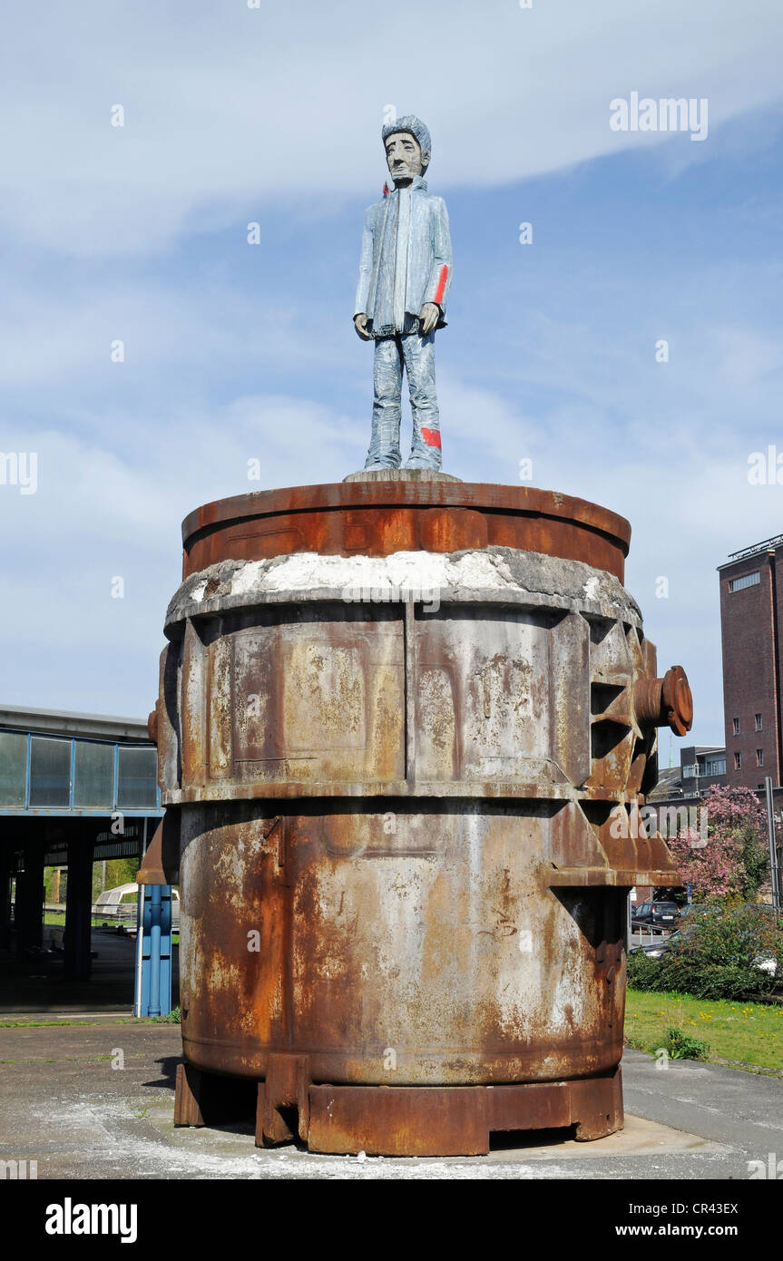 Foundry ladle with sculpture of a standing man, museum platform ...