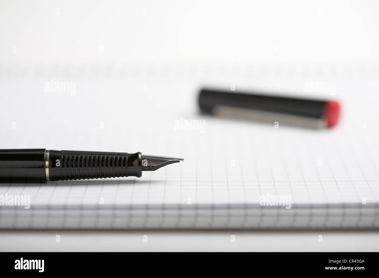 Pen on a writing pad Stock Photo - Alamy