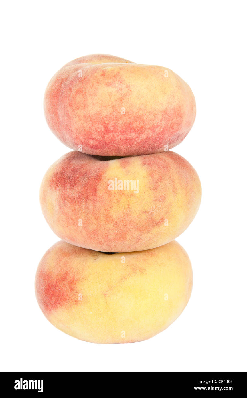 Pile of chinese flat peaches over a white background Stock Photo - Alamy