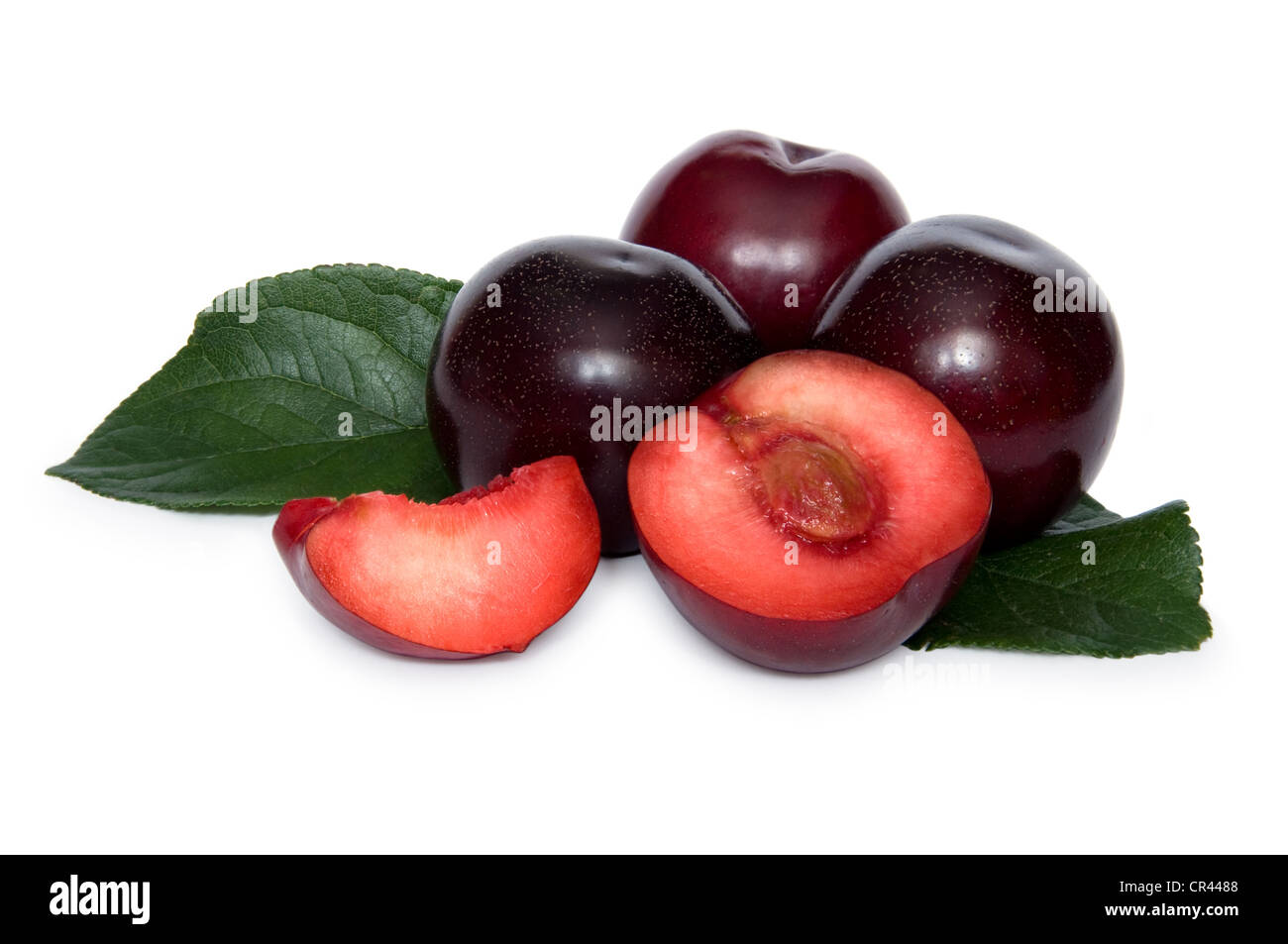 Whole half ripe plums Cut Out Stock Images & Pictures - Alamy