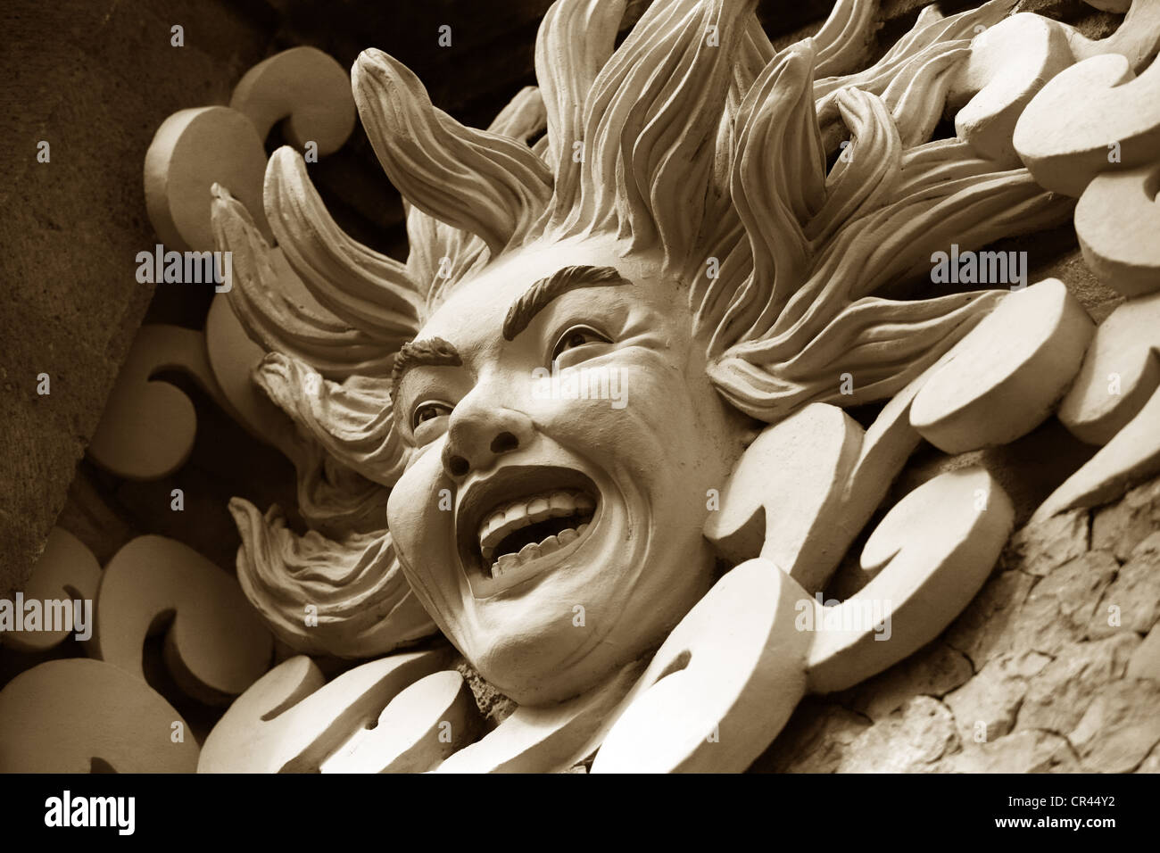 Bas-relief of the sun on a wall. Bali. Indonesia Stock Photo - Alamy