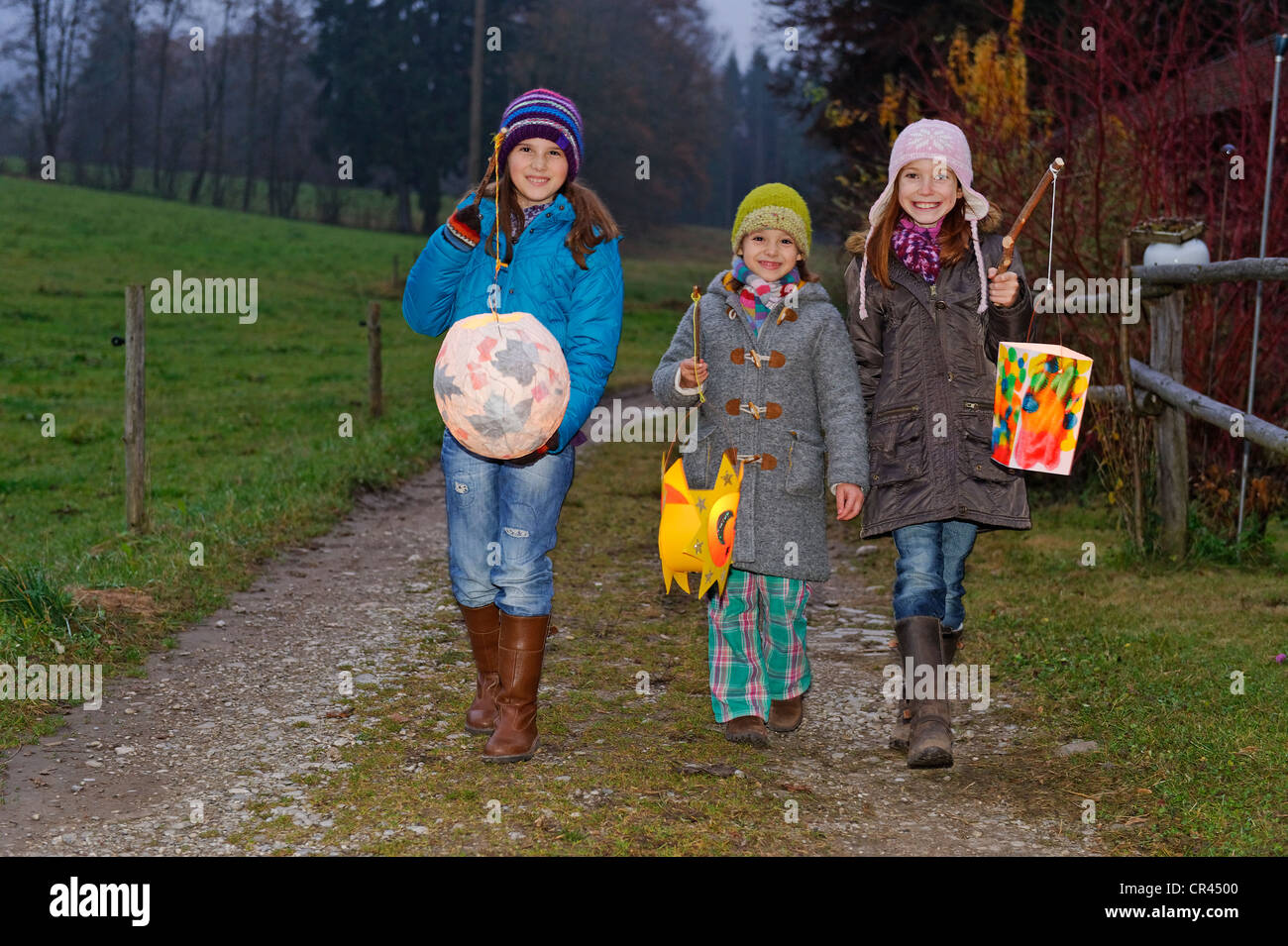 Girls carrying lanterns at a St. Martin's parade, lantern procession ...