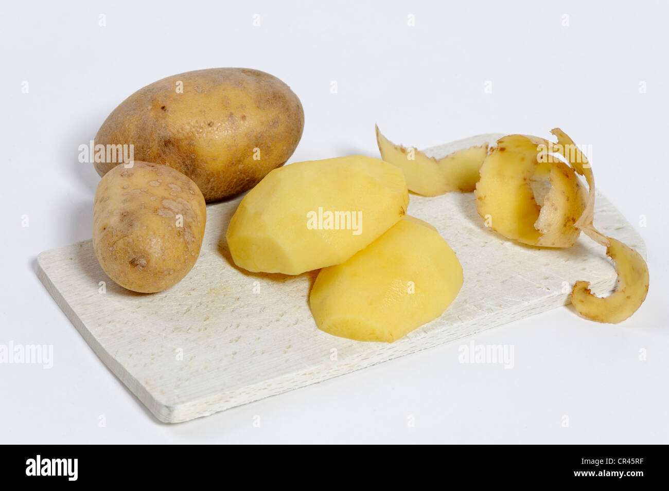 Potato peeling, peeled raw potatoes Stock Photo - Alamy