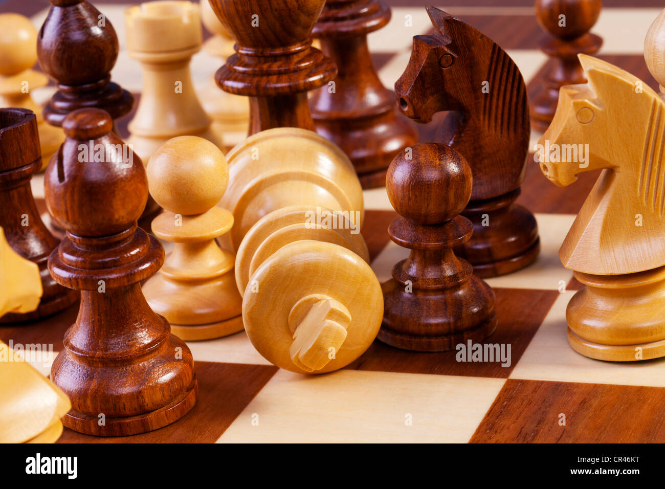 Game of chess in progress, focus on fallen white king Stock Photo - Alamy