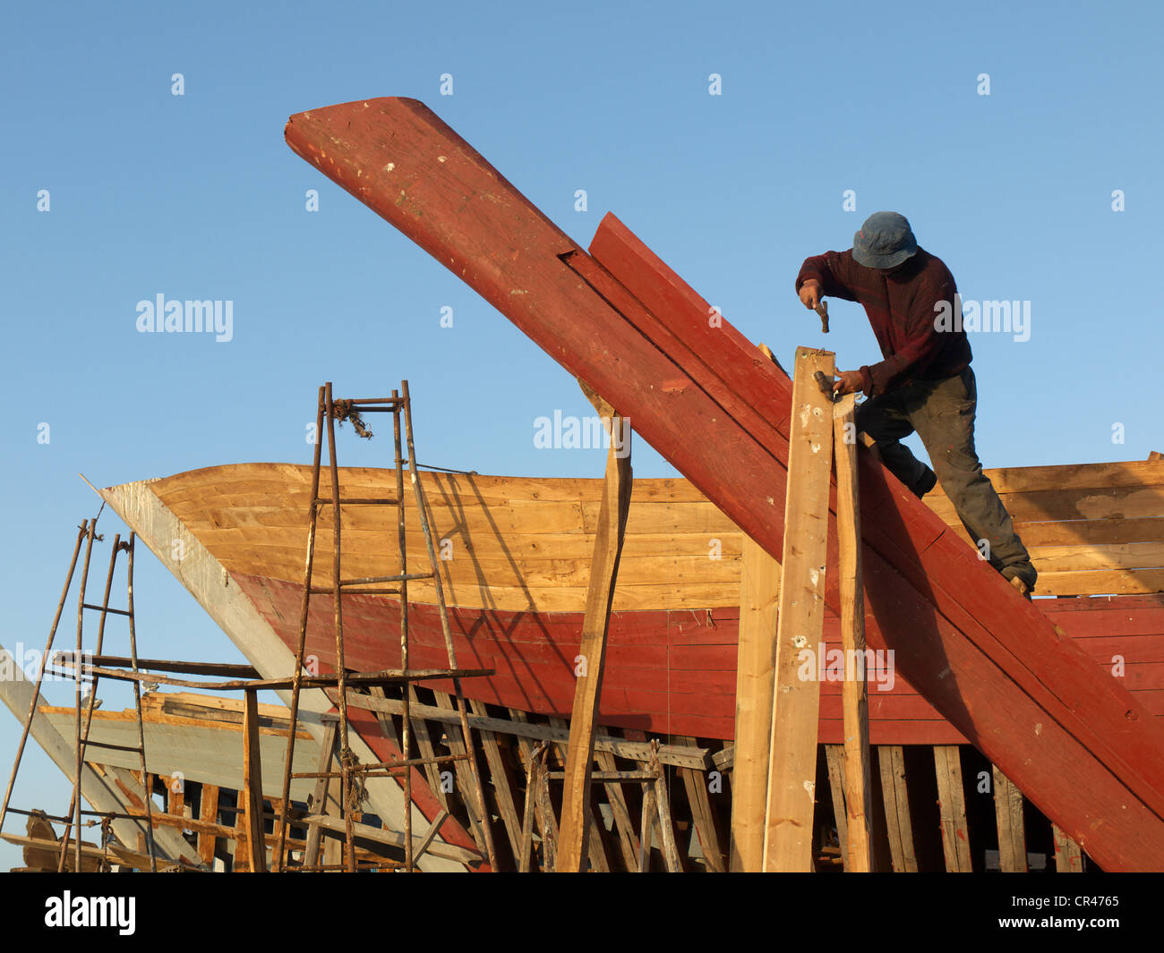Worker during the construction of a large fishing boat in a shipyard in ...