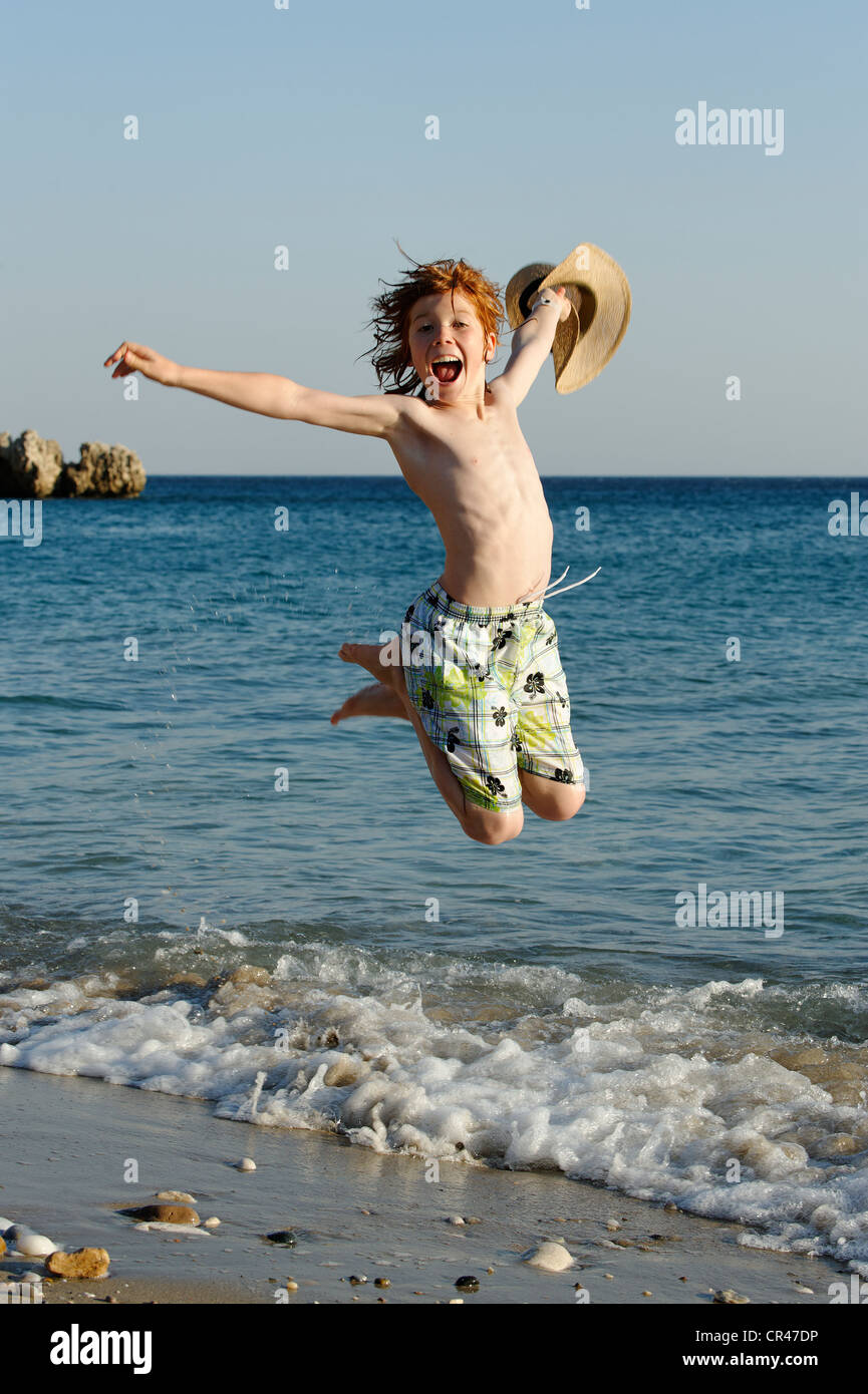 Jumping on a beach hi-res stock photography and images - Alamy