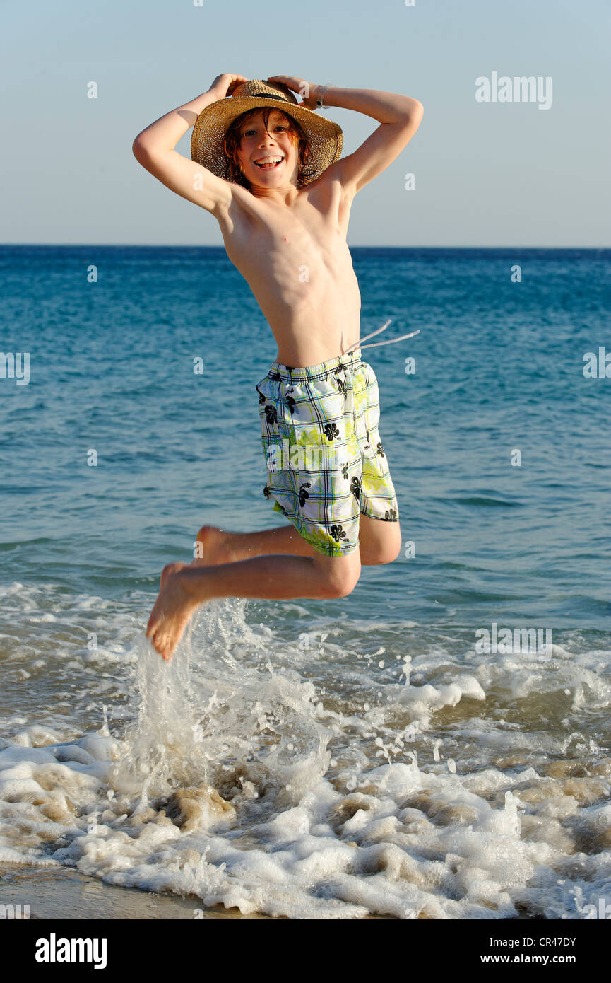 Jumping on a beach hi-res stock photography and images - Alamy