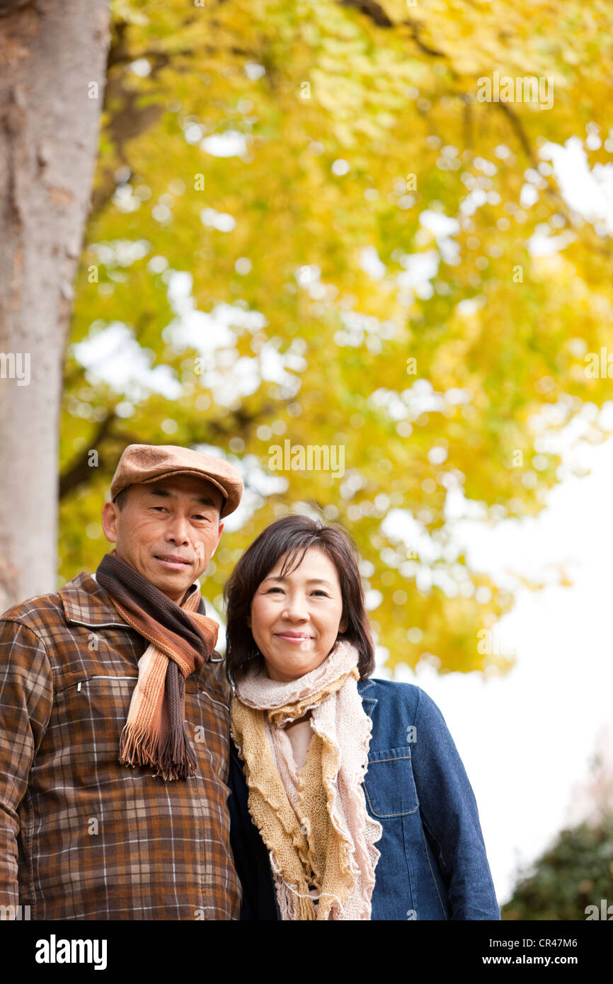 Couple Walking In the Woods In Autumn Stock Photo - Alamy