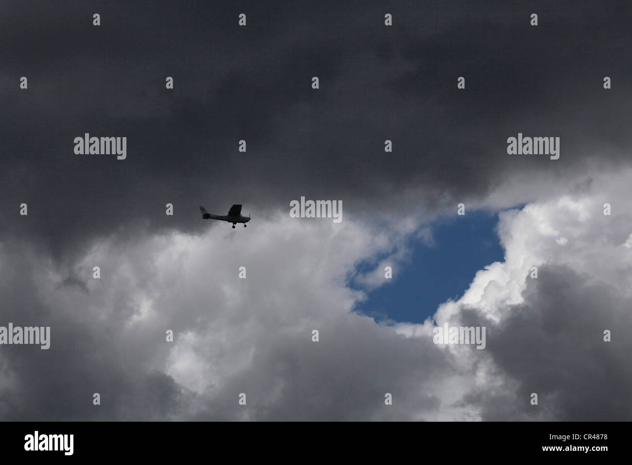 Aircraft flying against rain clouds hi-res stock photography and images ...