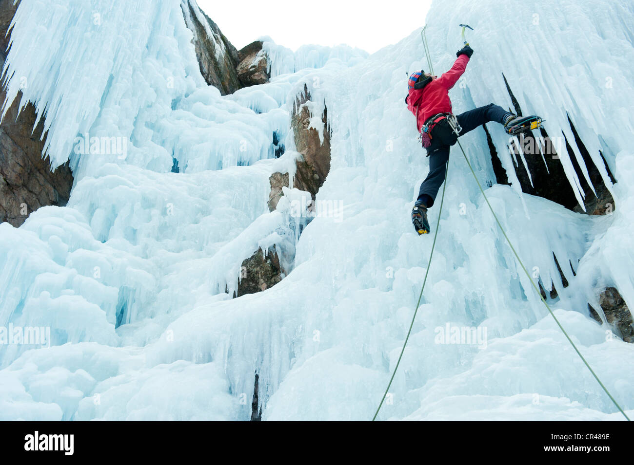 Man at ice climbing low angle view hi-res stock photography and images ...