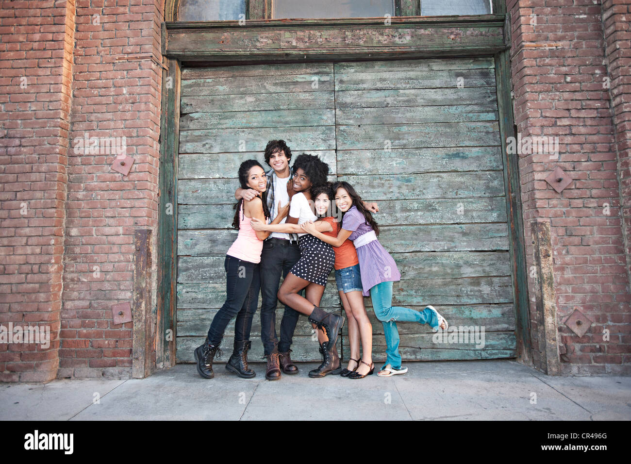 Friends hugging and hanging out Stock Photo - Alamy