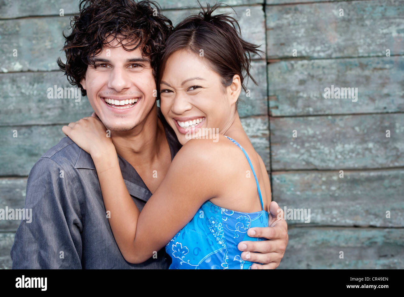 Smiling couple hugging Stock Photo - Alamy