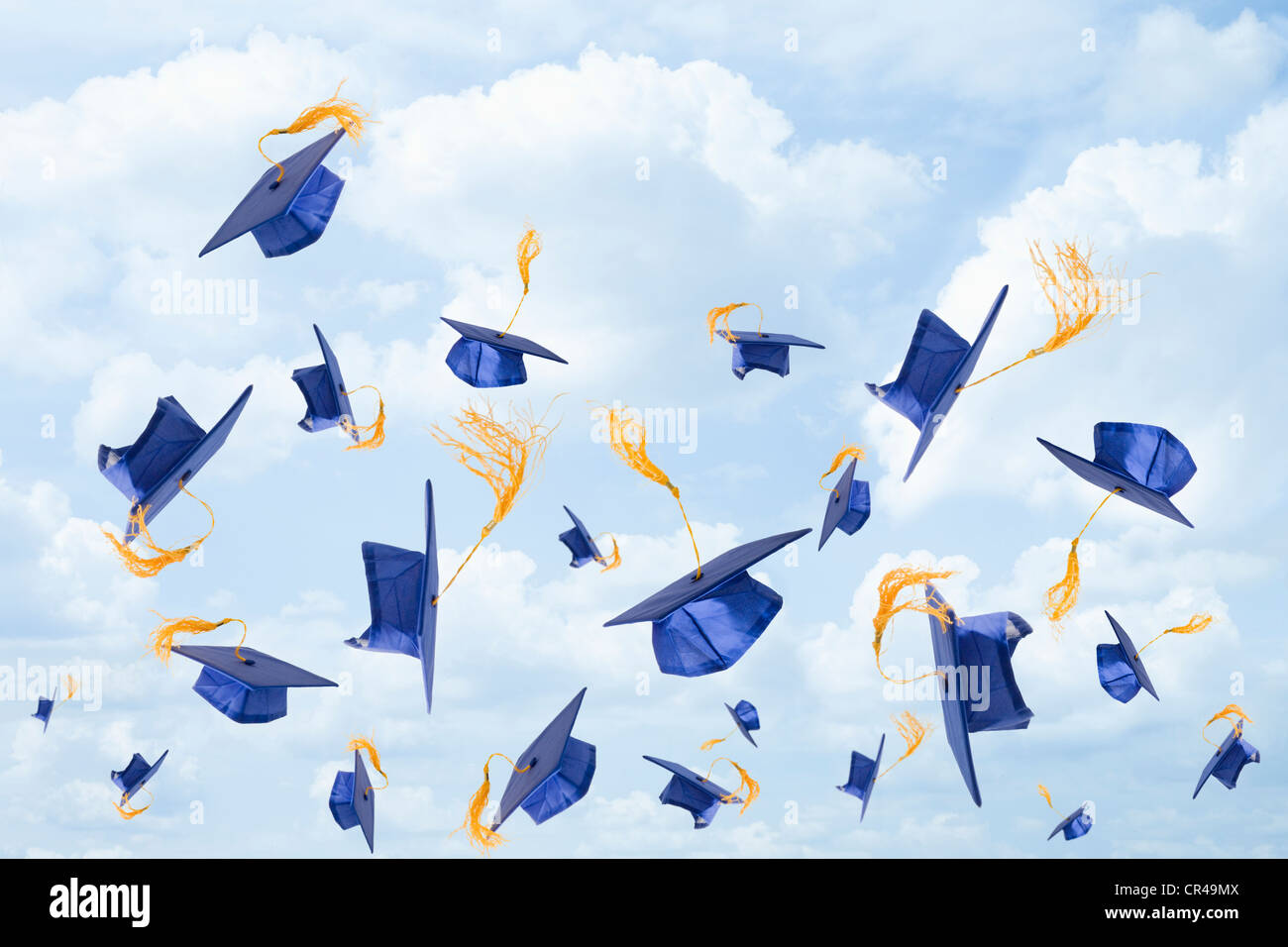 Blue Graduation Caps In The Air