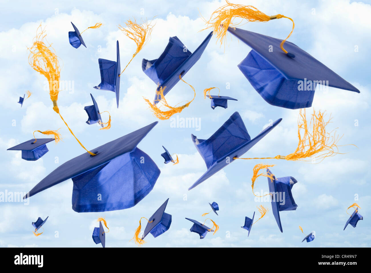 Graduation mortarboards being thrown in the air Stock Photo - Alamy