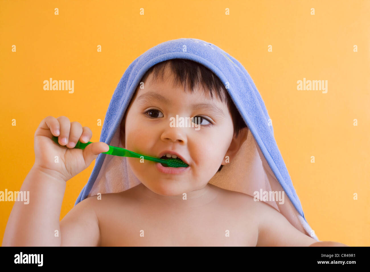 Hispanic boy brushing teeth Stock Photo - Alamy