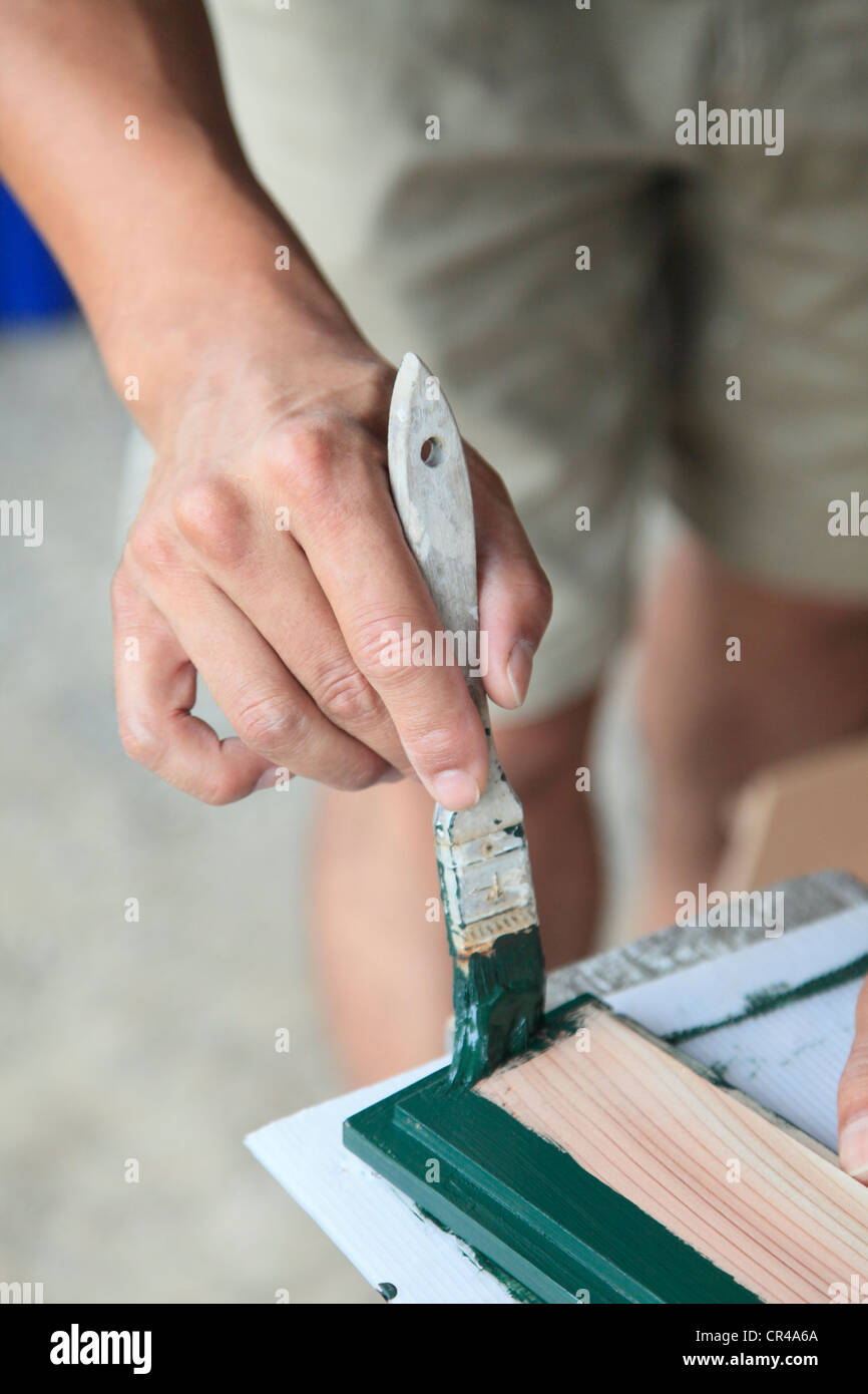 Cabinet Maker Putting Paint on Wood Stock Photo - Alamy