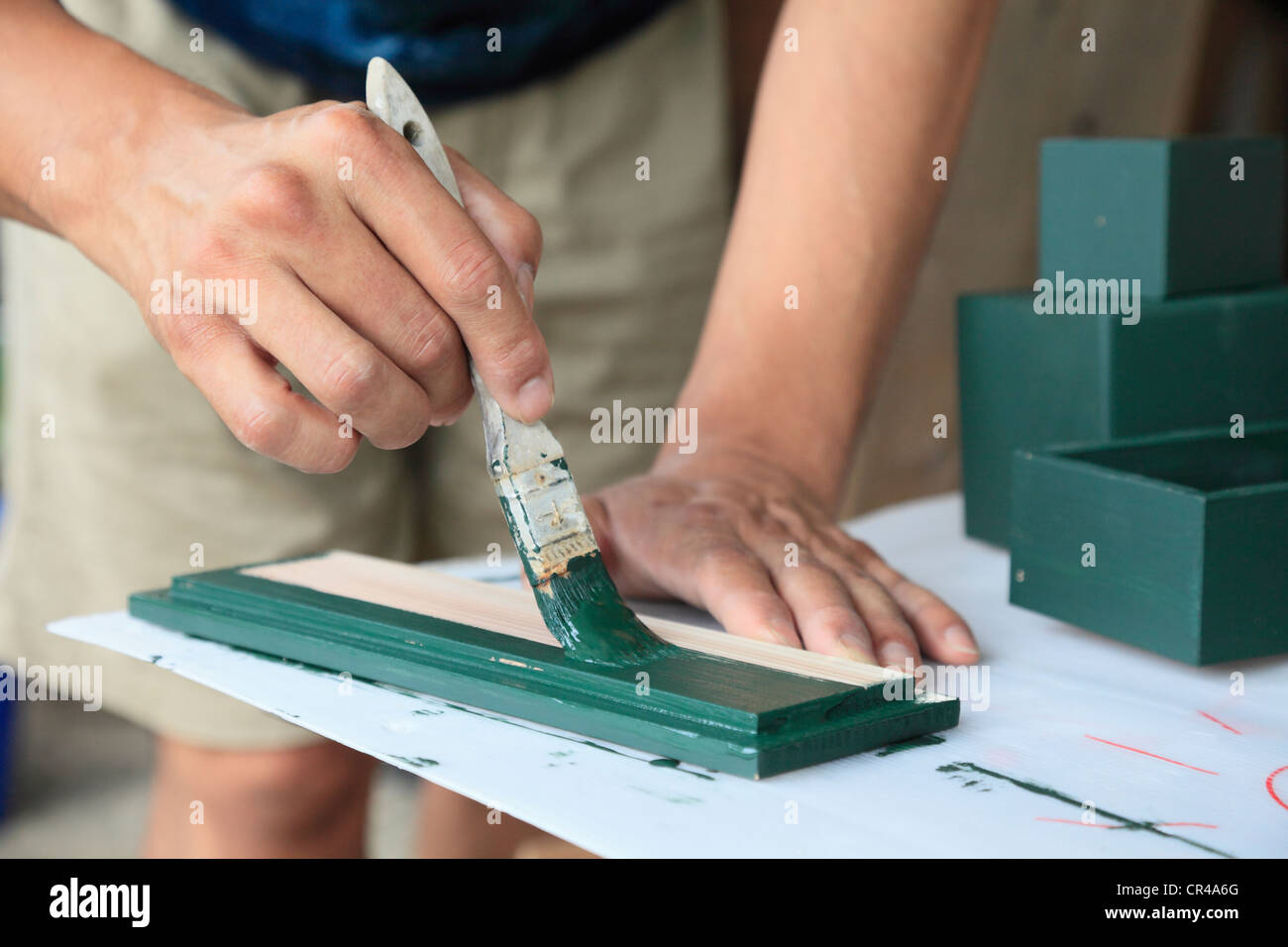 Cabinet Maker Putting Paint on Wood Stock Photo - Alamy