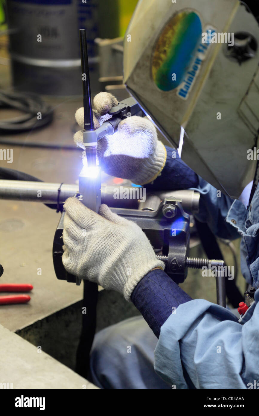Machinery Mechanic Using Welding Machine Stock Photo - Alamy