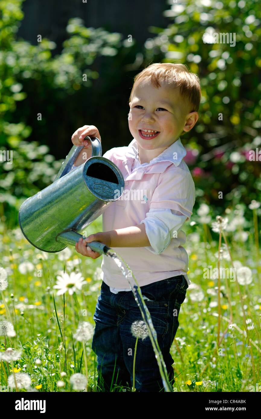Kids watering can hi-res stock photography and images - Alamy