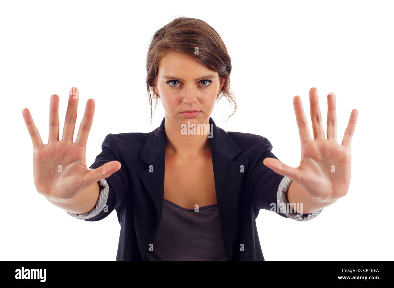 Serious young attractive woman with her hand signaling stop isolated ...